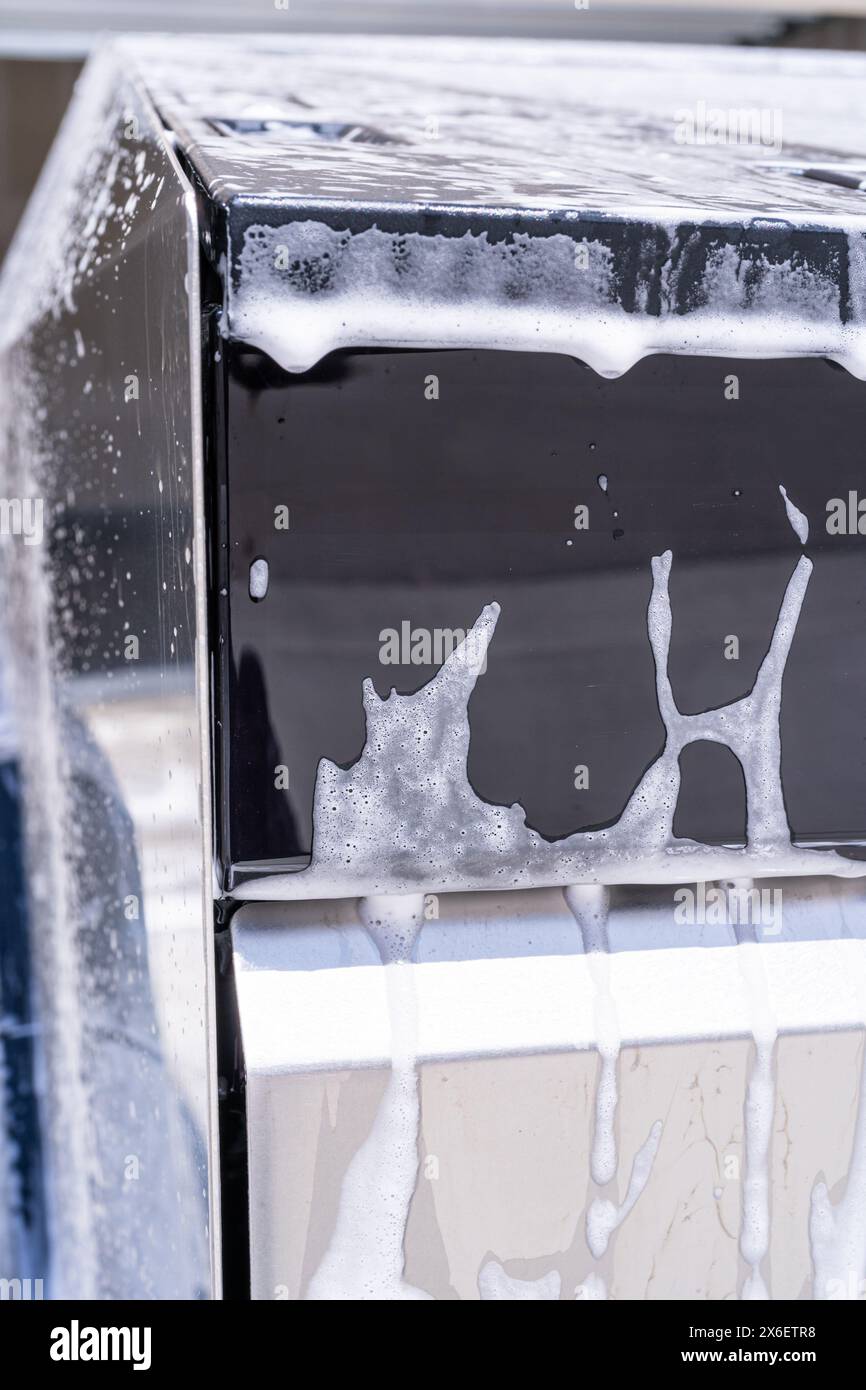 Soap Suds Dripping from the Edge of Tesla Cybertruck Window Stock Photo ...