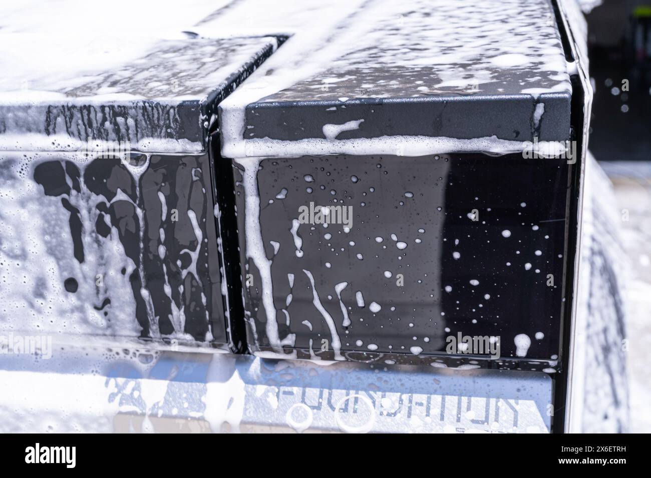 Soap Suds Dripping from the Edge of Tesla Cybertruck Window Stock Photo ...