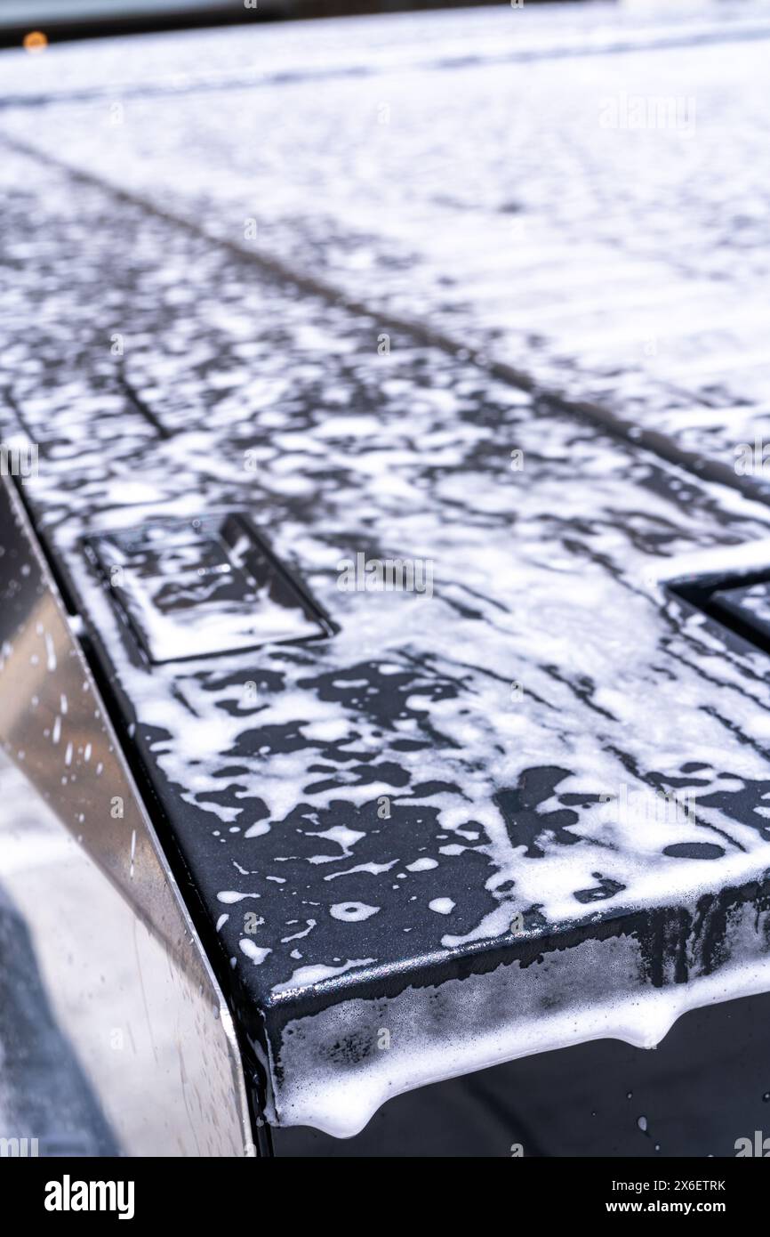 Soap Suds Dripping from the Edge of Tesla Cybertruck Window Stock Photo ...