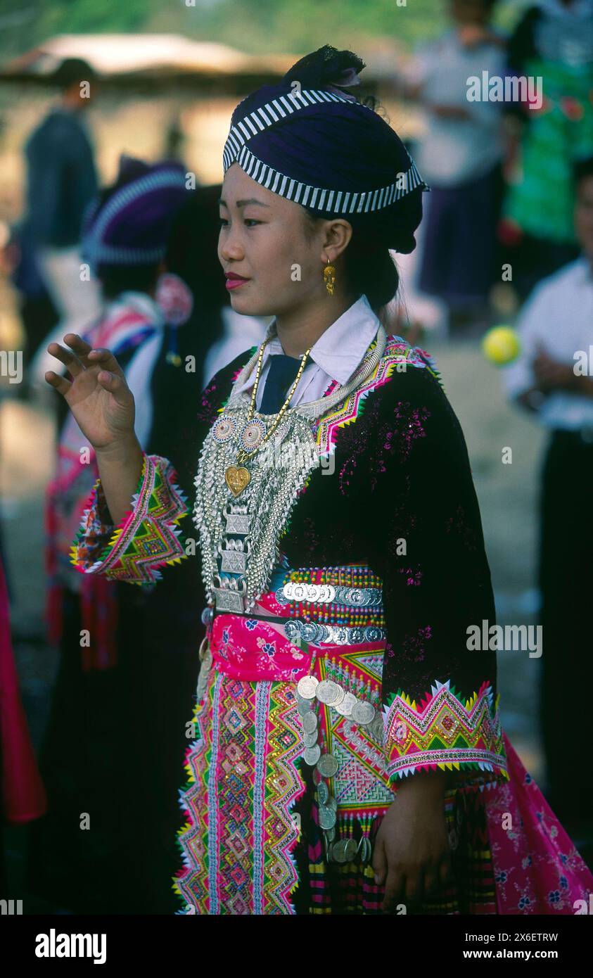 Hmong girls in traditional costume at courting ceremony throwing tennis ...