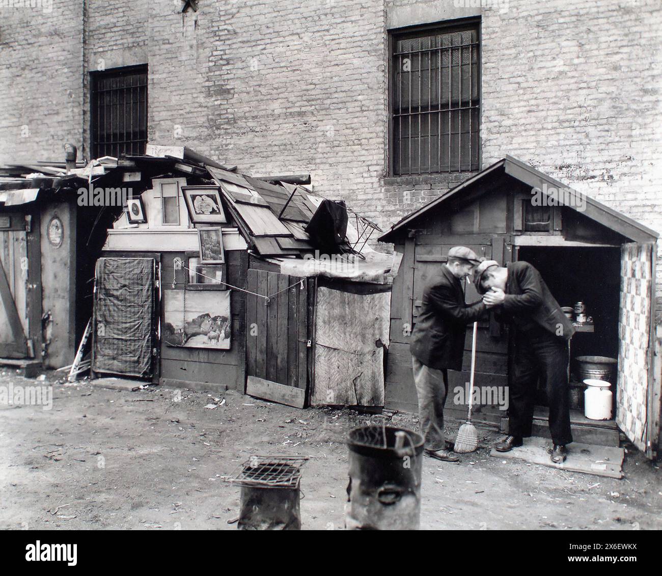 Two homeless men smoking cigarettes, unemployed and huts, West Houston ...