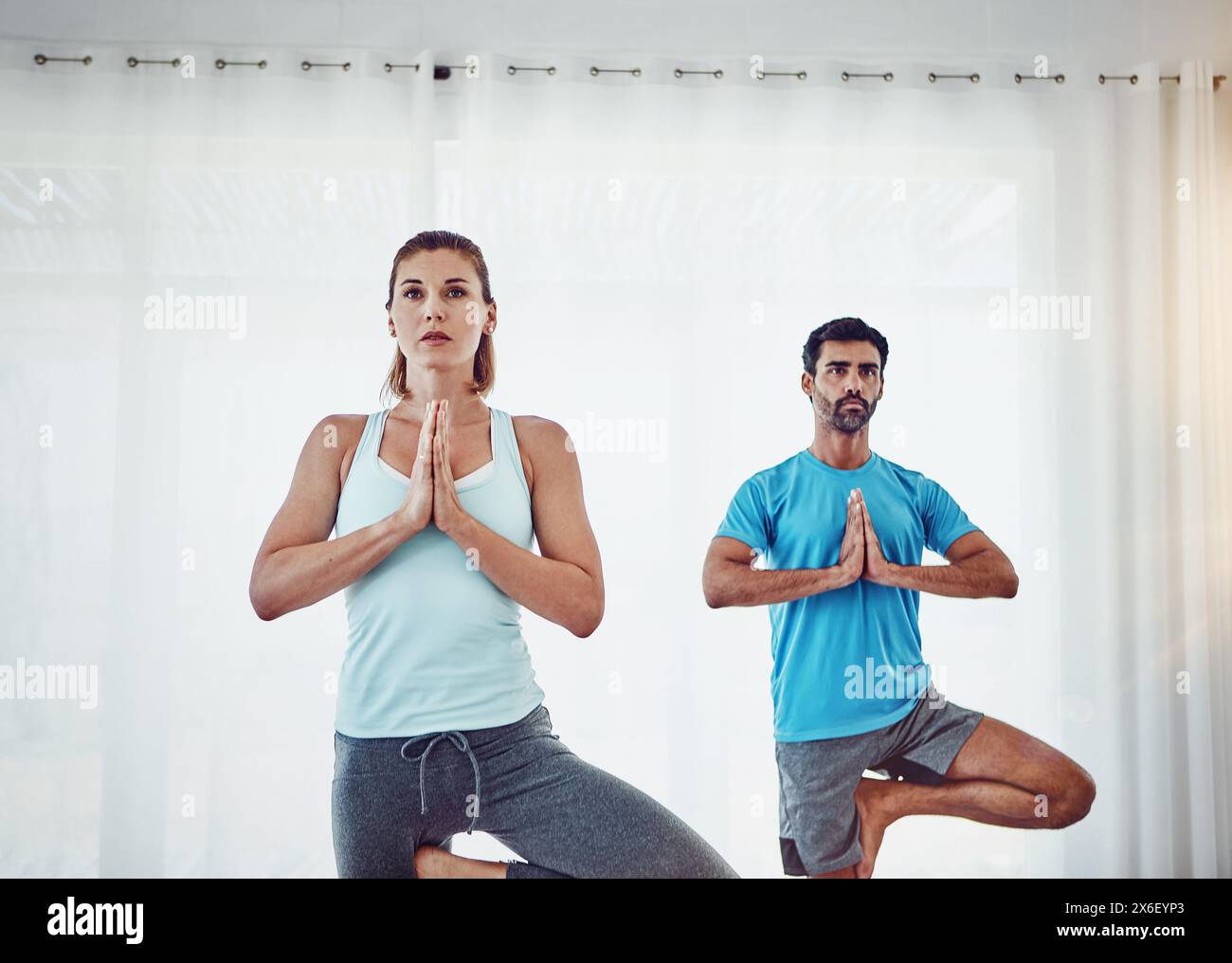 Yoga, meditation and couple in home for spiritual fitness, wellness and ...