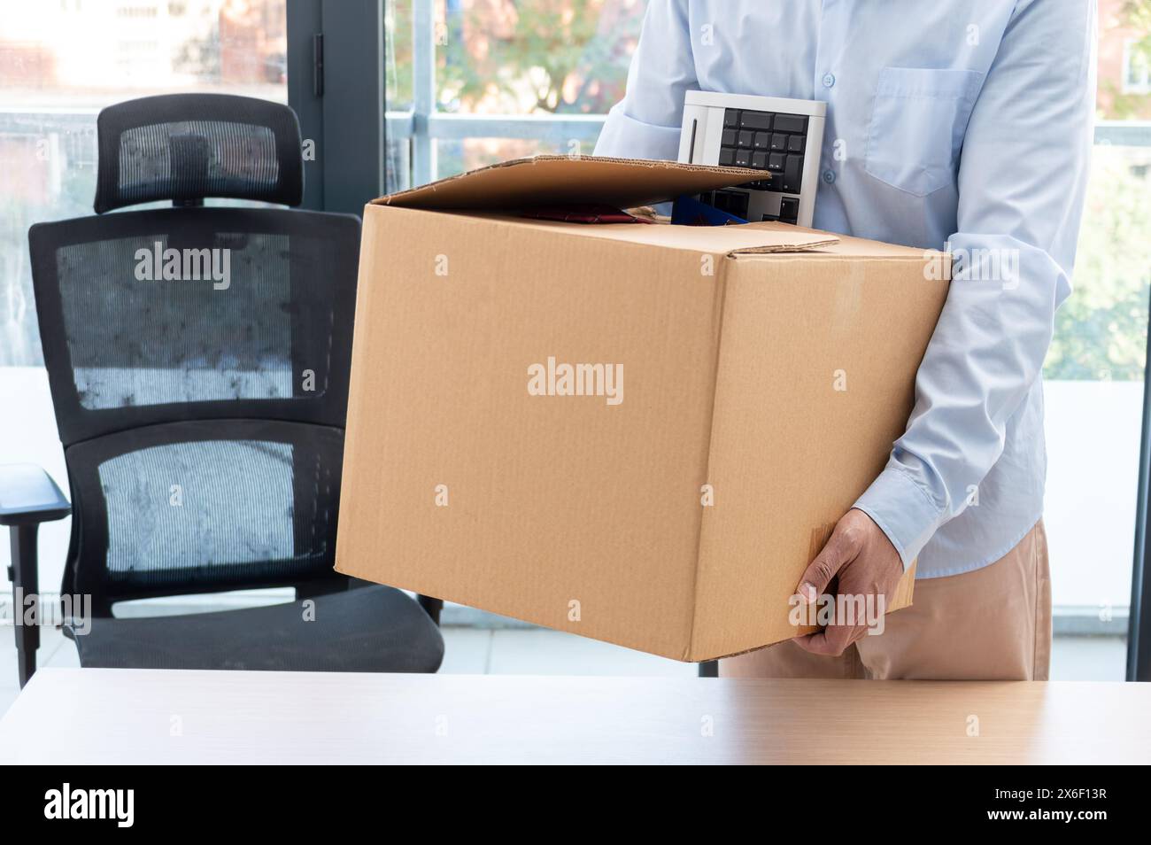 Leaving work carrying box hi-res stock photography and images - Alamy