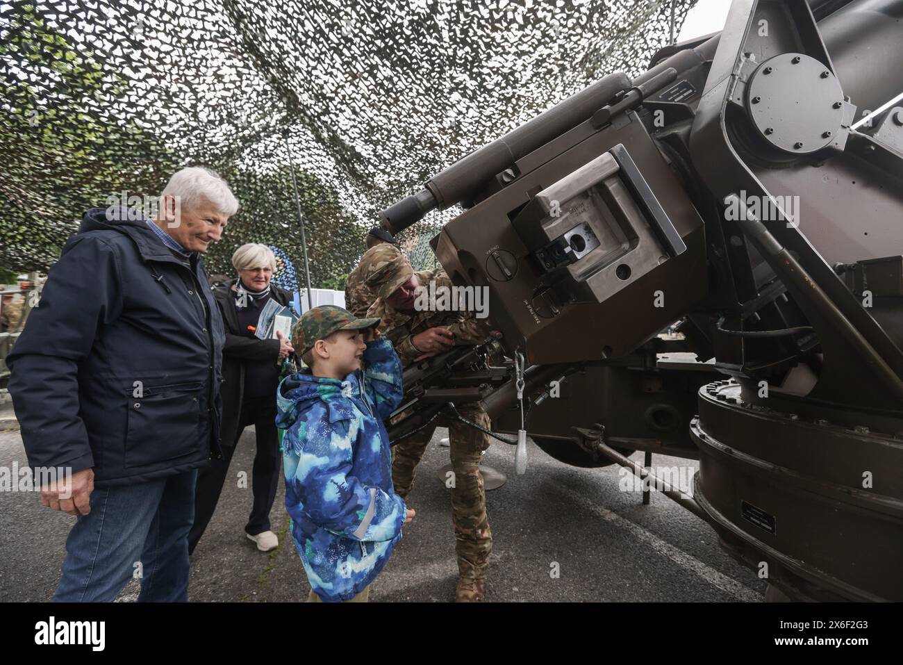 Maribor, Slovenia. 14th May, 2024. People look at a 155 mm howitzer ...