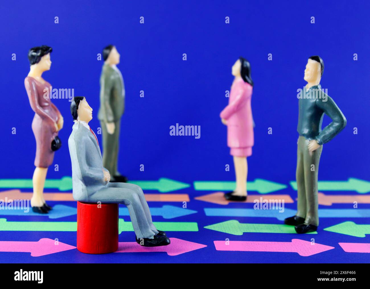 People walking on arrows going in different directions Stock Photo - Alamy