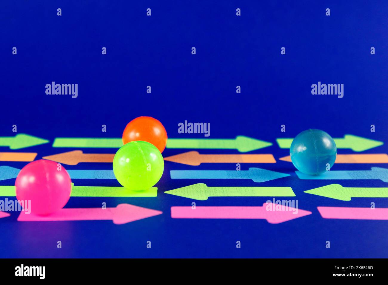 Spheres moving on arrows that go in different directions Stock Photo ...