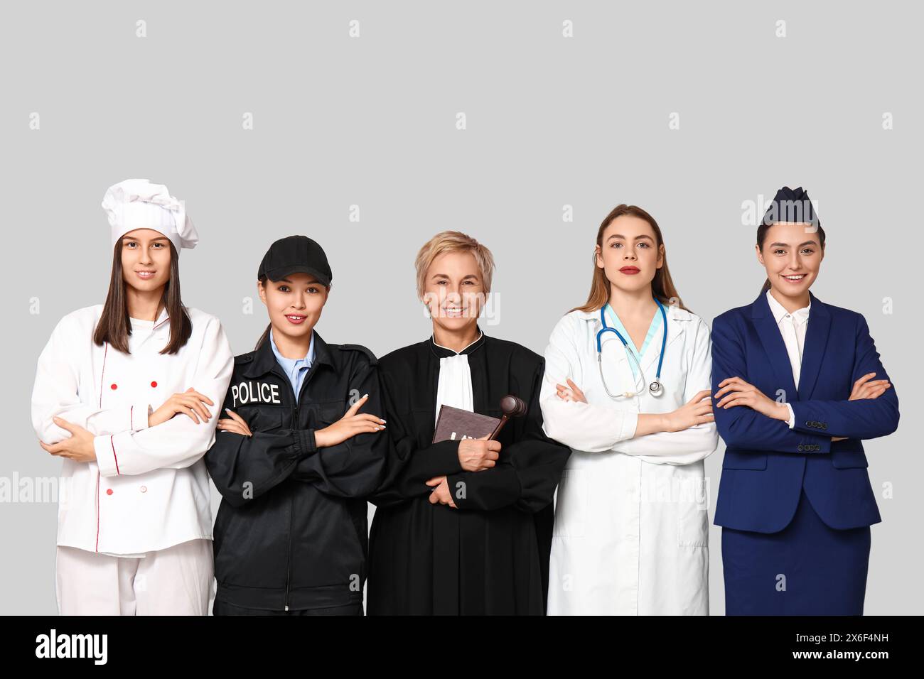 Women of different professions on grey background Stock Photo - Alamy
