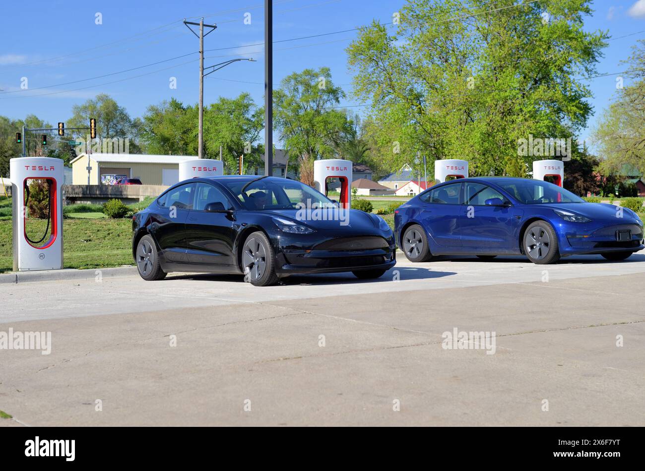 Rochelle, Illinois, USA. Tesla vehicles being recharged at an electric ...