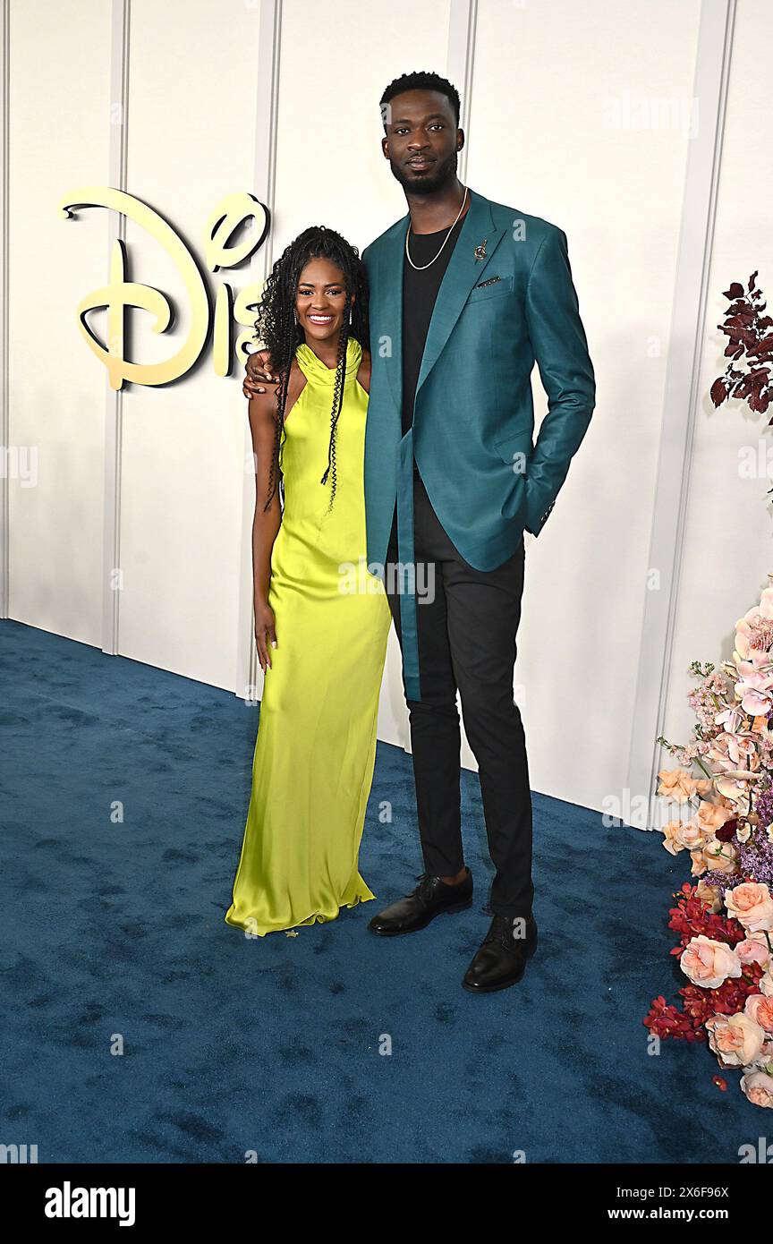 Charity Lawson and Dotun Olubeko attends the Disney 2024 Upfront Red ...