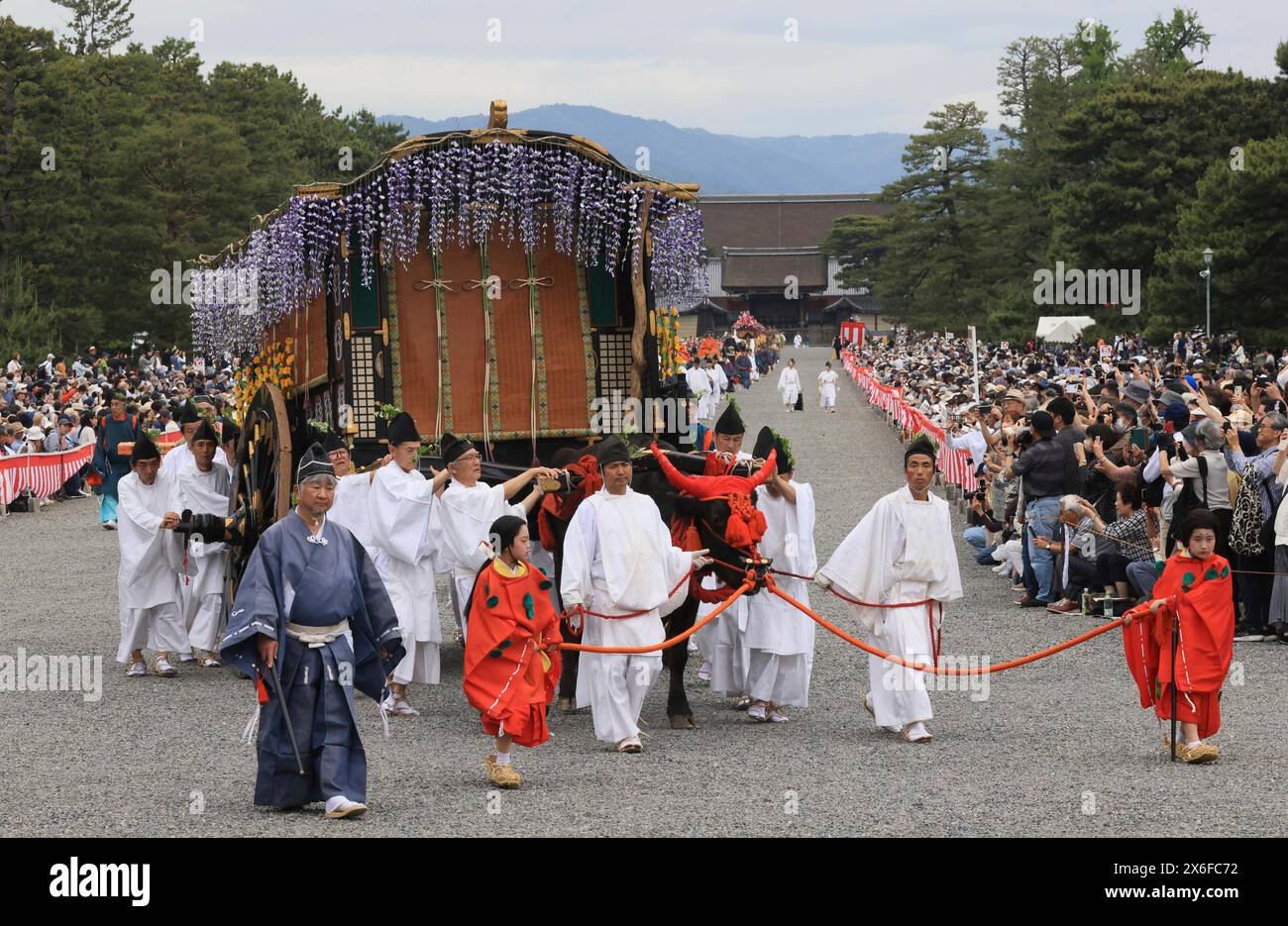 A parade of people wearing splendid ancient costumes and traditional ...