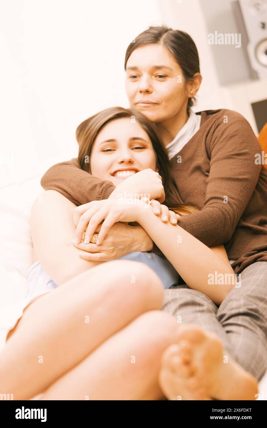 Peaceful interaction between a mother and her daughter who rests ...