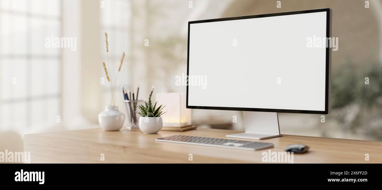 A white-screen PC computer mockup and accessories on a wooden desk in a ...
