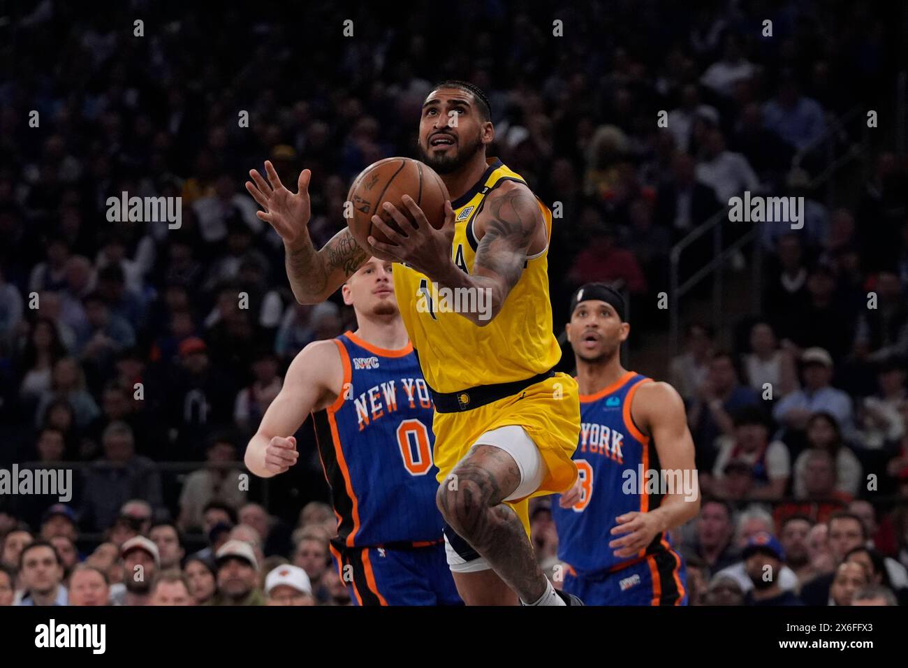 Indiana Pacers' Obi Toppin (1) drives past New York Knicks' Donte ...