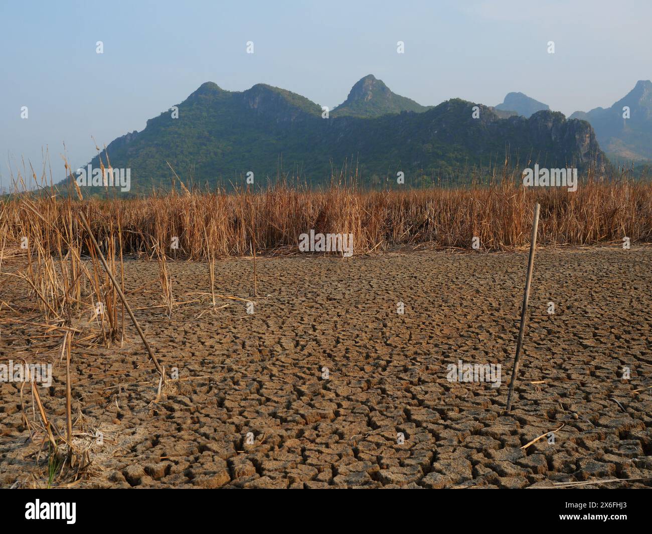 Scorched earth soil drought desert landscape dramatic with mountain in ...