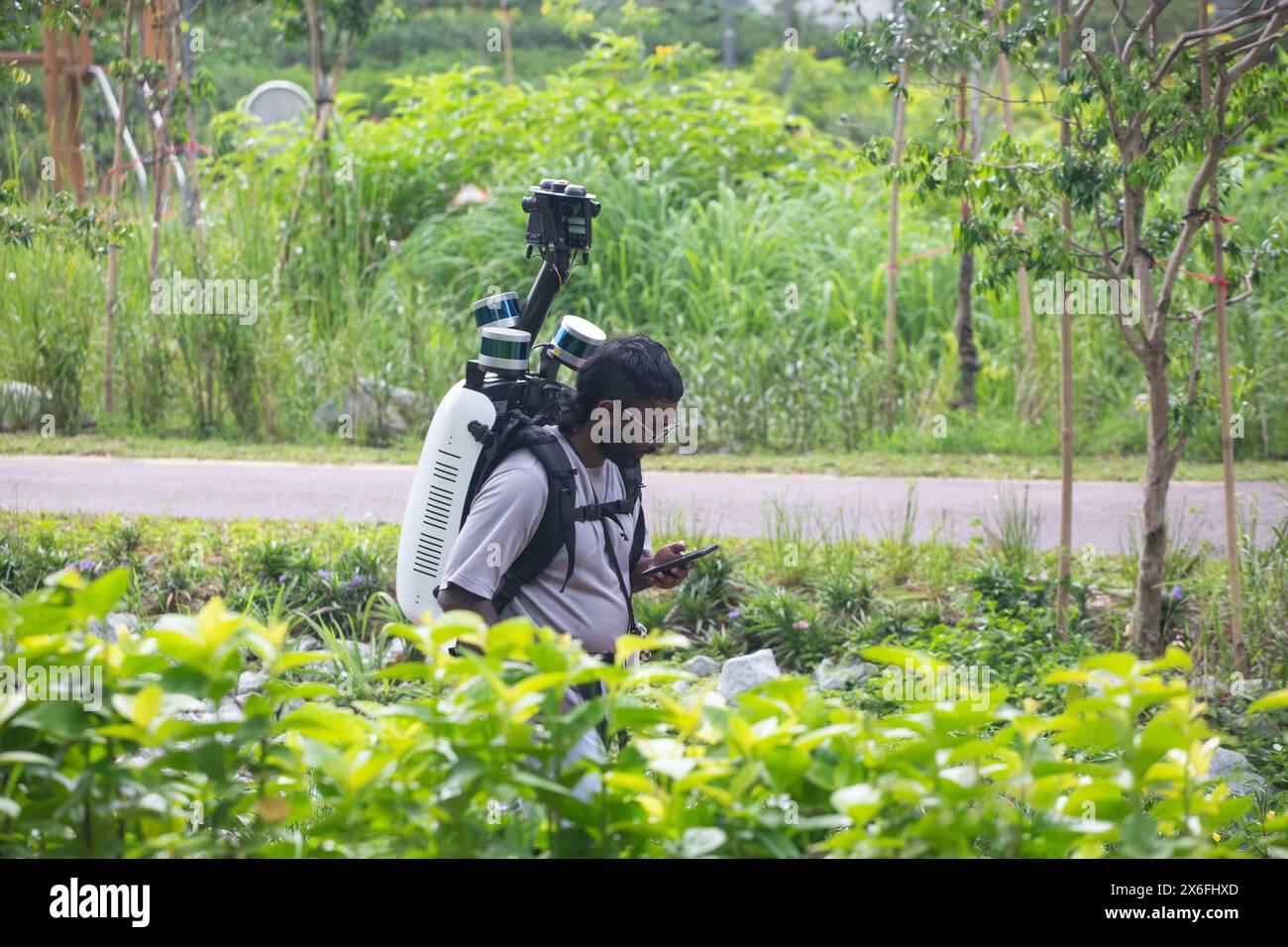 A man carry Apple Map heavy electronic backpack mounted four cameras on ...