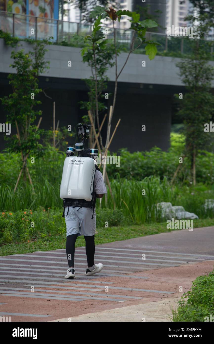 A man carry Apple Maps heavy electronic backpack mounted four cameras ...