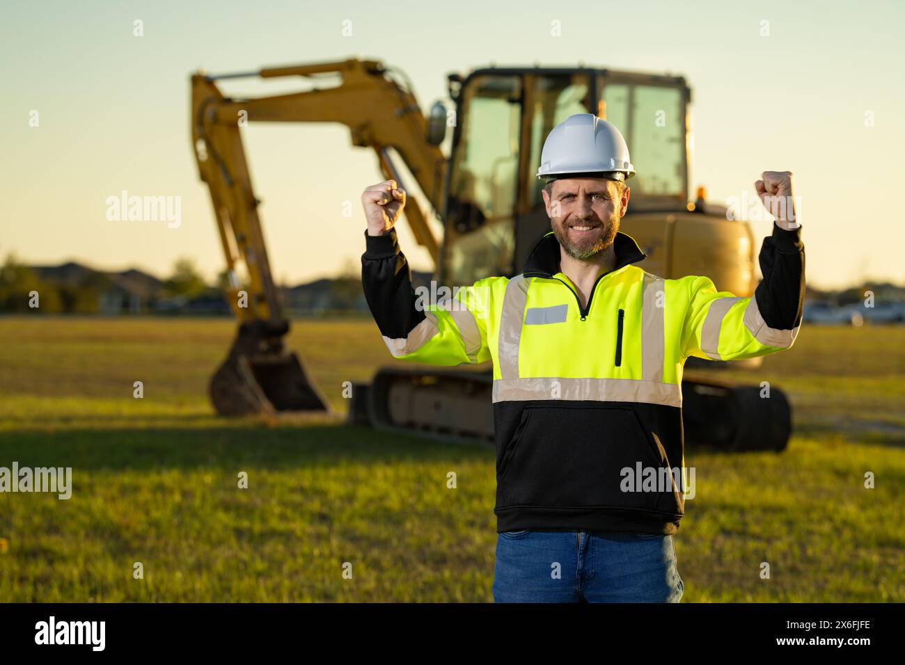 Builder in helmet on the construction site Stock Photo - Alamy