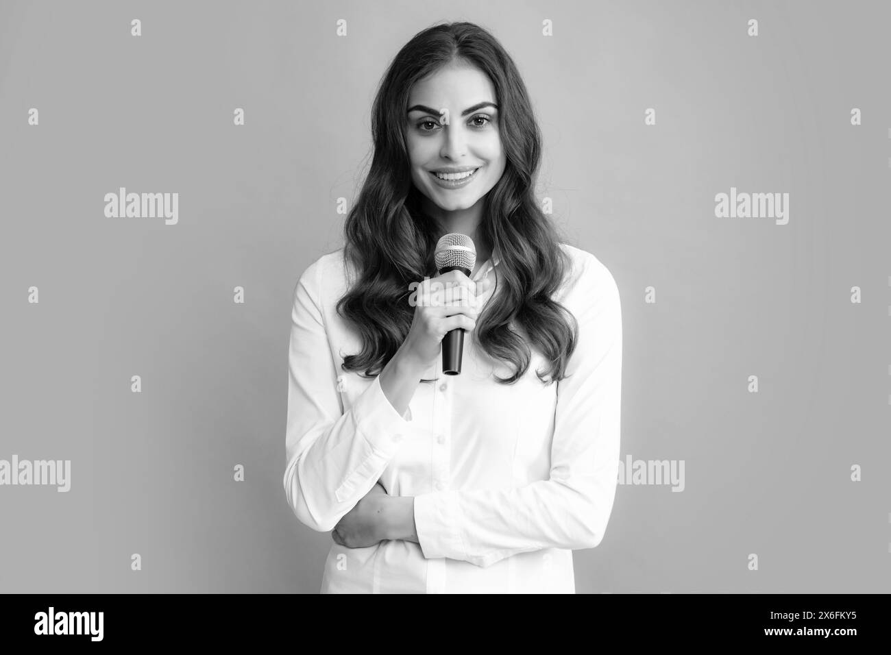 Beautiful business woman is speaking on conference. Stylish girl ...