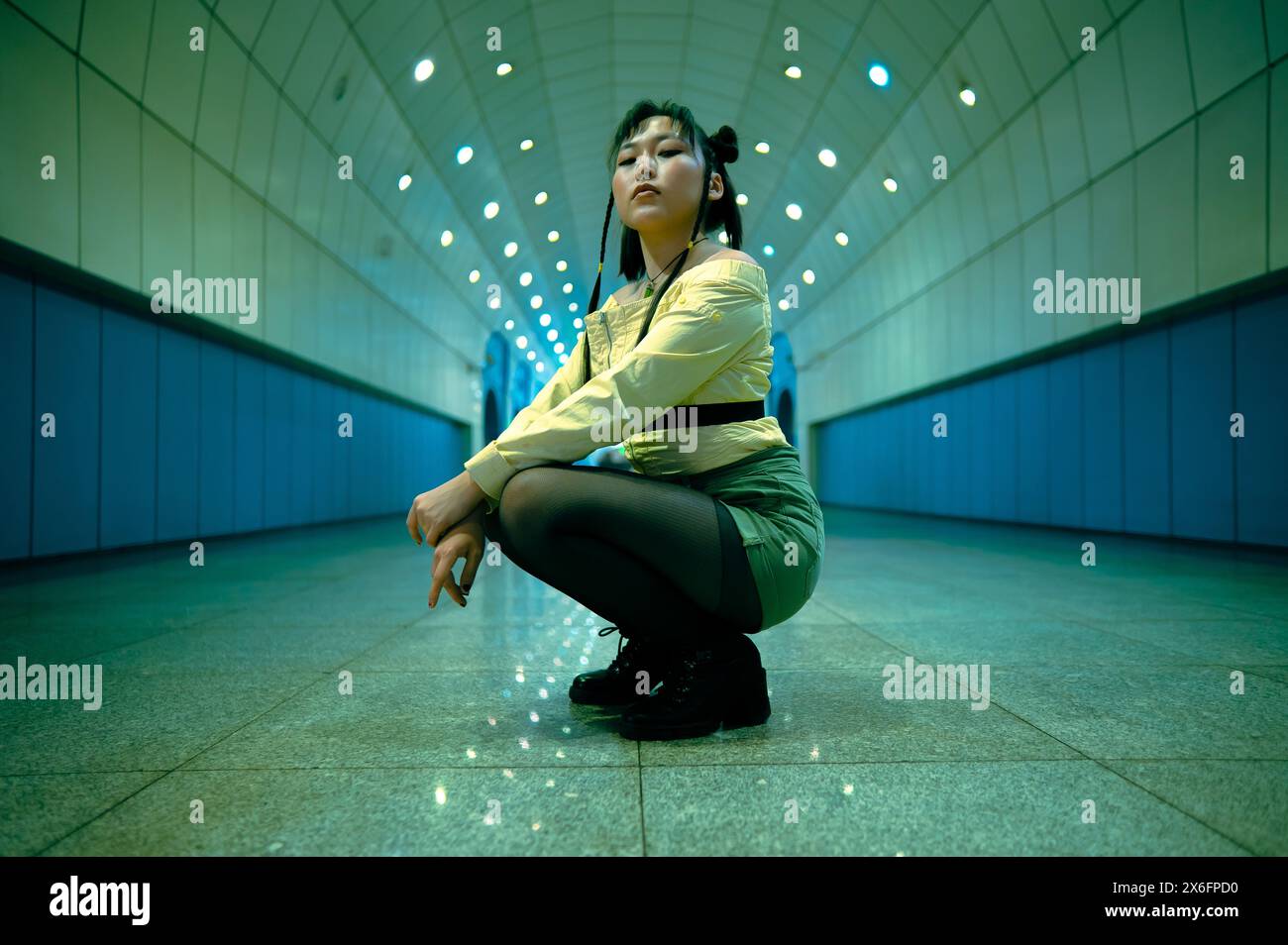 Asian young woman posing in the subway passage Stock Photo - Alamy