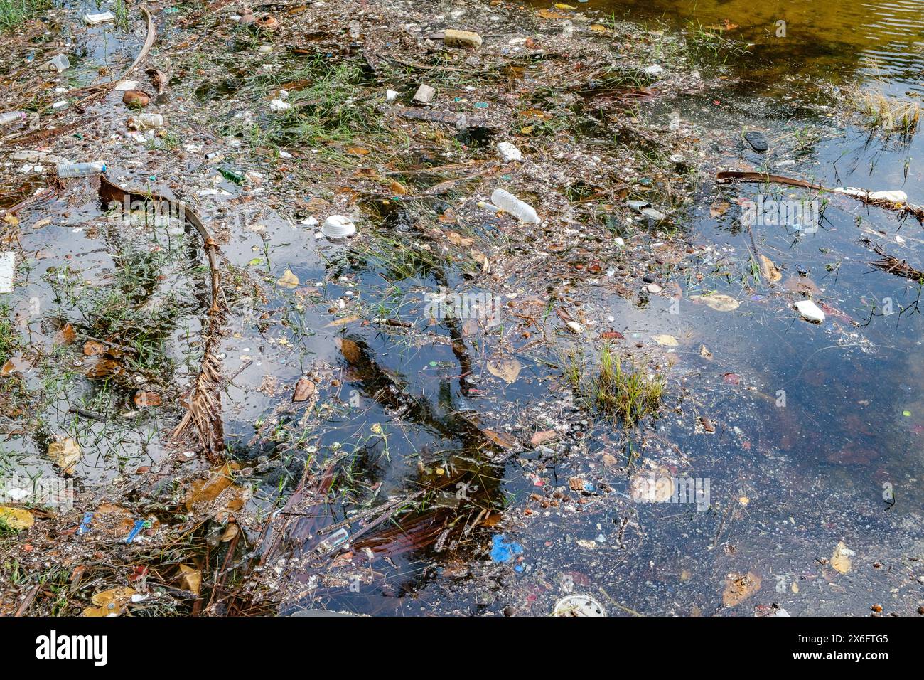 household and plastic garbage in river, environmental pollution Stock ...