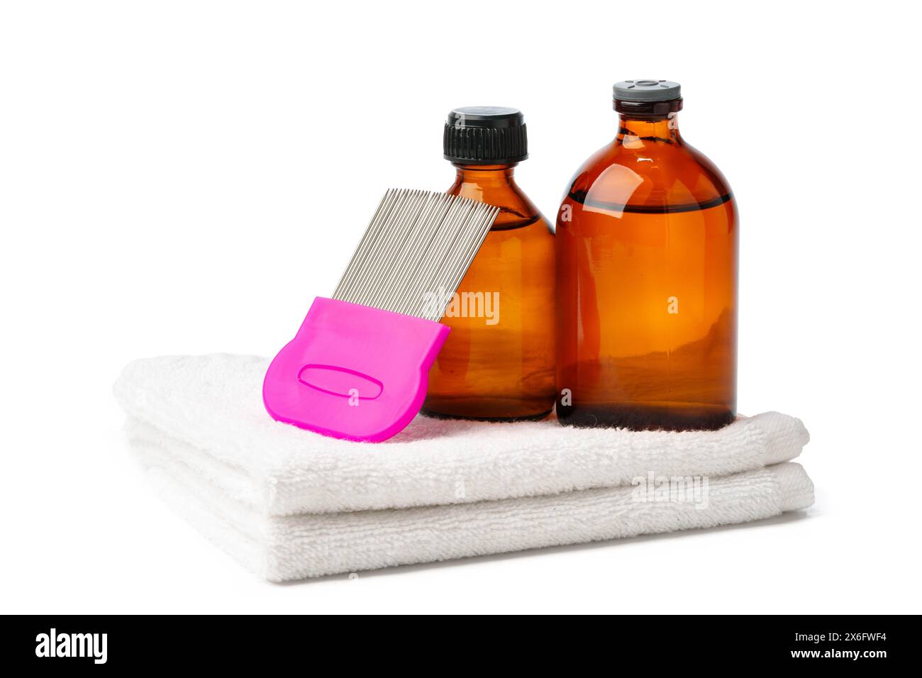 Comb, anti lice medicine and towel on white background Stock Photo - Alamy