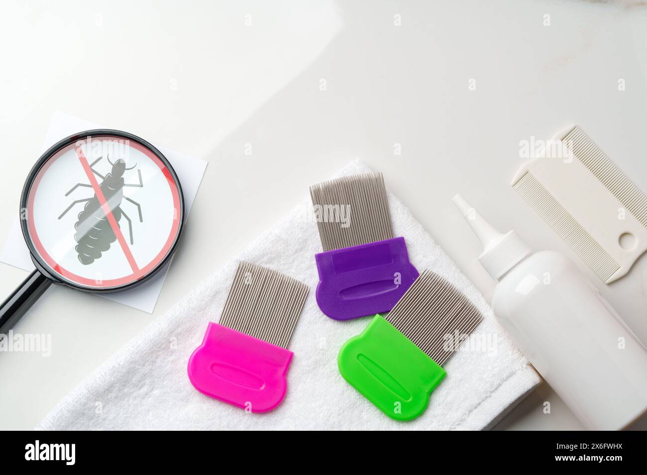 Comb, anti lice medicine and towel on white background Stock Photo - Alamy