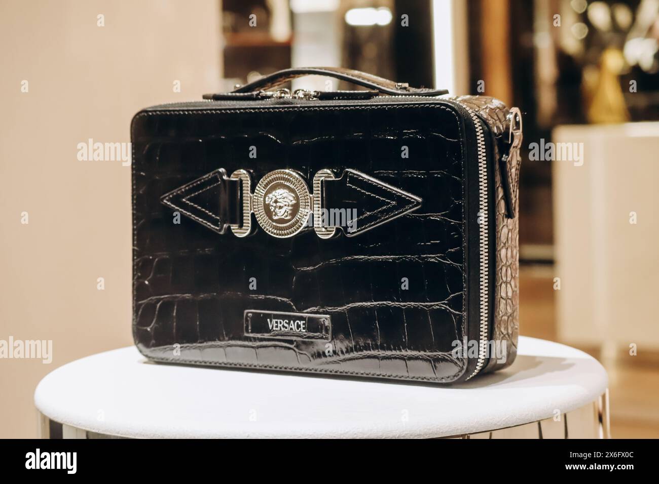 Florence, Italy - 29 December, 2023: Versace bag in a display window at ...