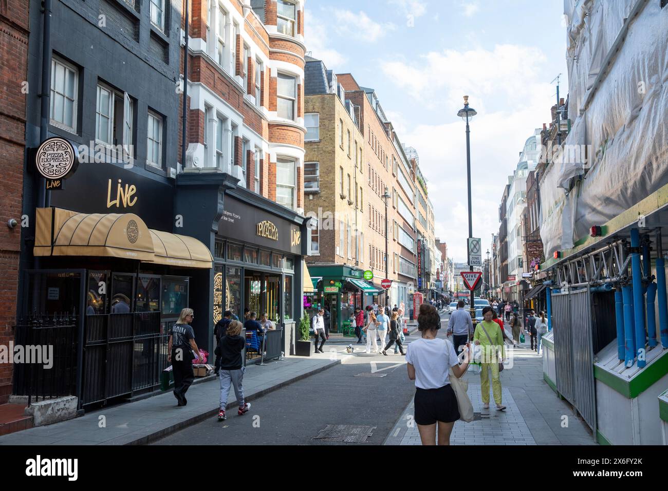 Soho London, people and shops on Dean street in the west end of London ...