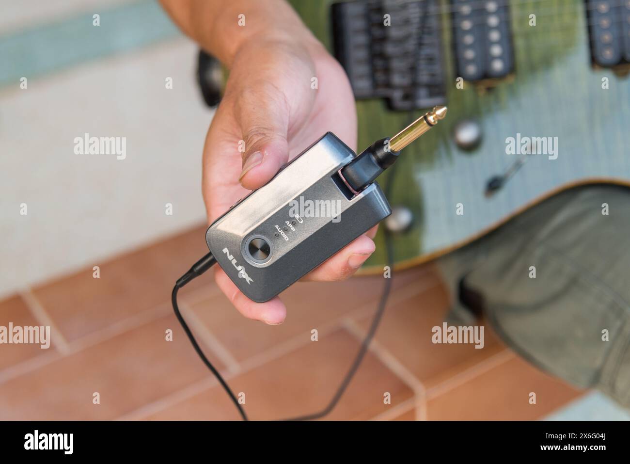 Rachaburi,Thailand - 24 April, 2024: Connect the Nu-X MP3 mighty plug ...