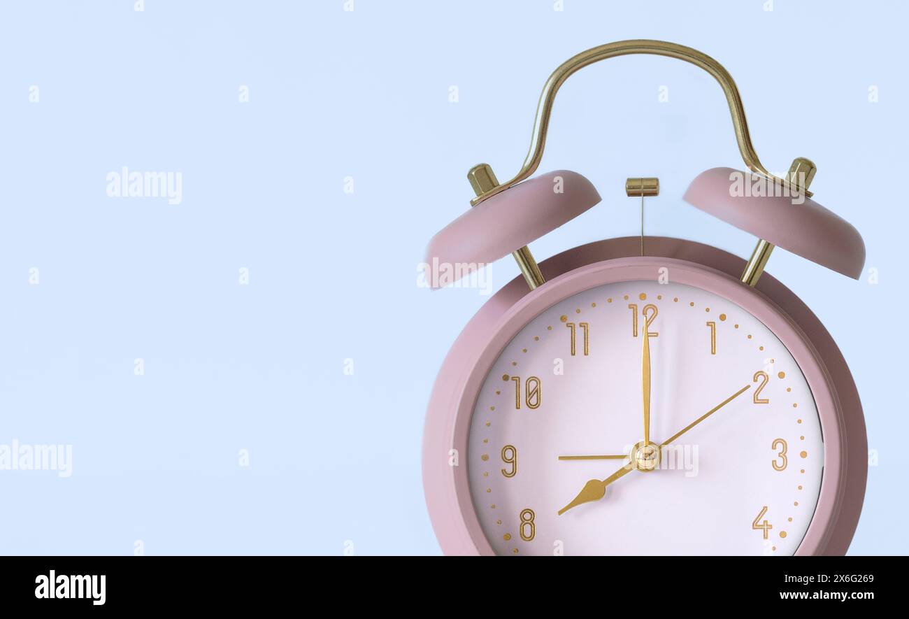 Pink mechanical alarm clock. Close-up. soft blue backgroundof. Clock of ...