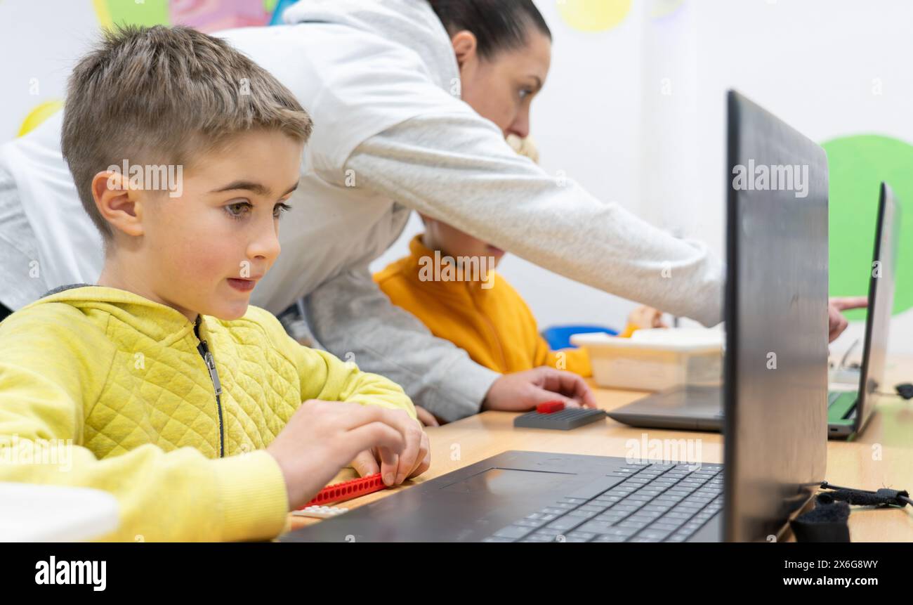 Robotics class for children with a teacher Stock Photo - Alamy