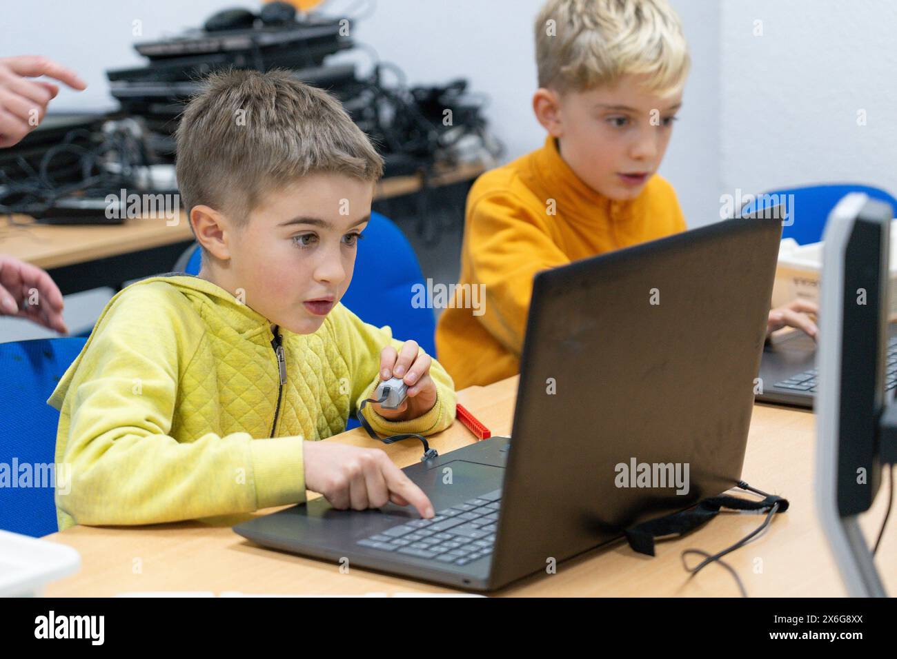 Two school-aged children in a robotics workshop Stock Photo - Alamy
