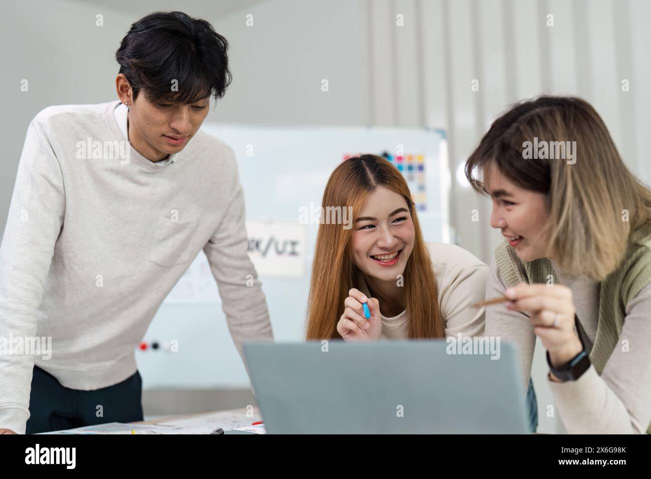 team of UI UX web designer are working together to develop mobile ...