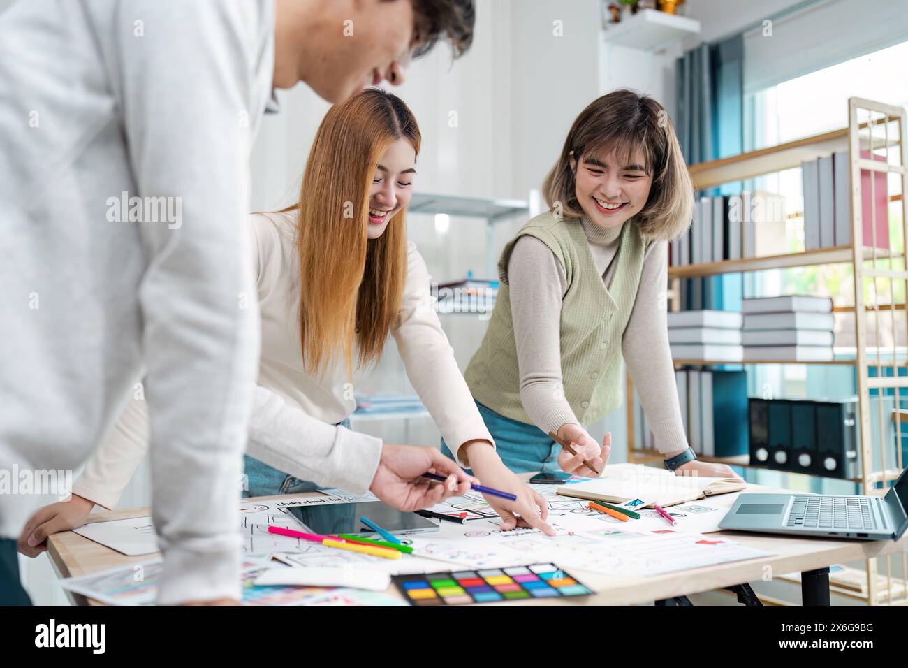 team of UI UX web designer are working together to develop mobile ...