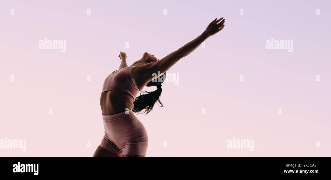 Woman showcasing her dance skill in a ballet performance. Standing ...