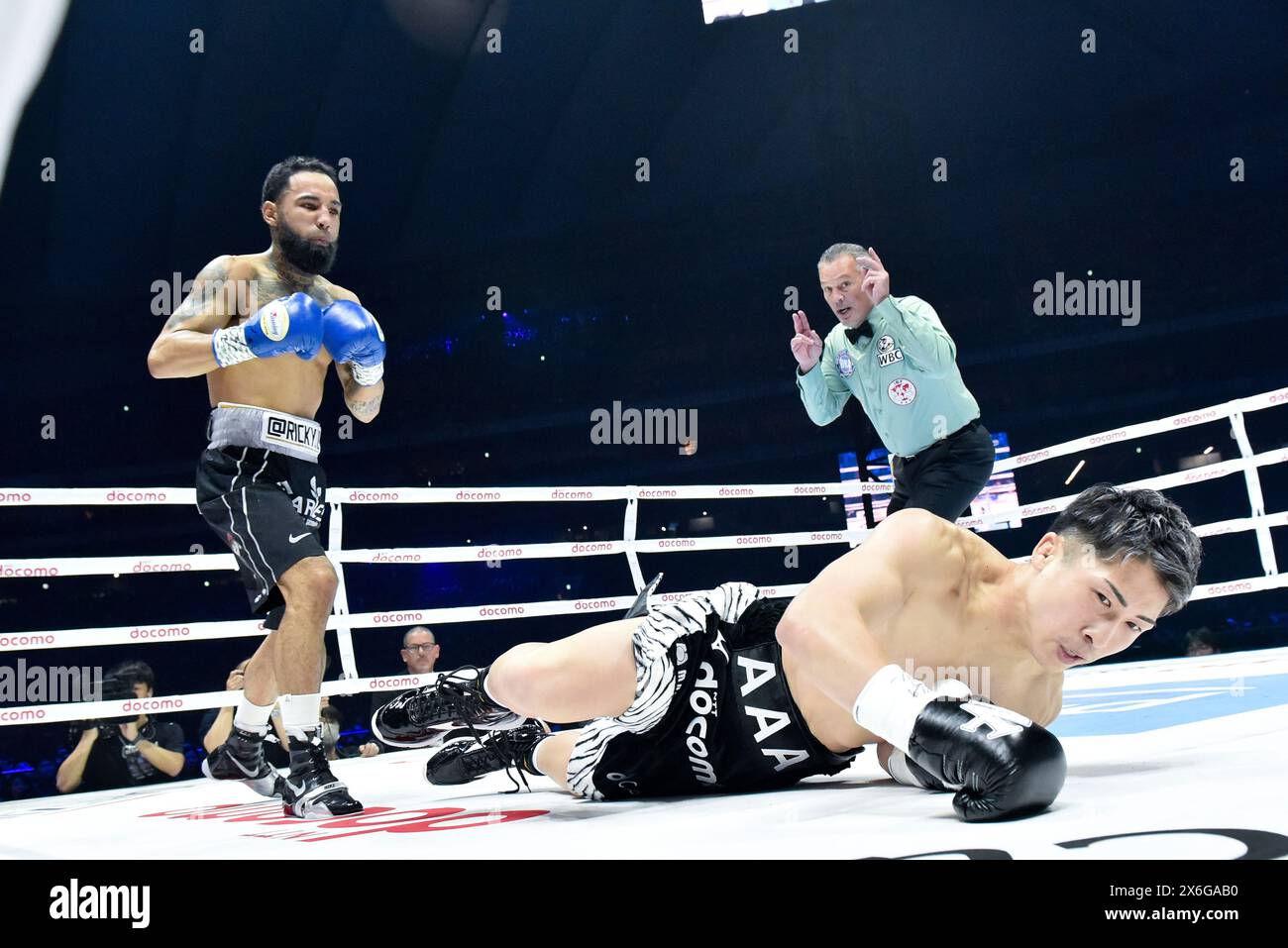 Japan's Naoya Inoue (R) is knocked down by Mexico's Luis Nery in the first round during their ...