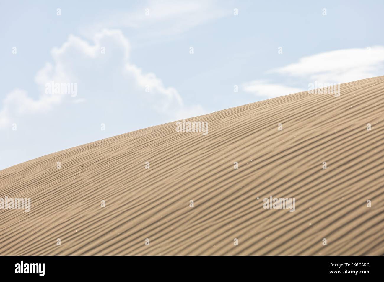 Texture of dunes in desert Sand shaped like wave on earth blue sky with ...