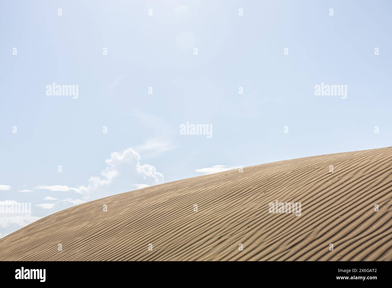 Texture of dunes in desert Sand shaped like wave on earth blue sky with ...