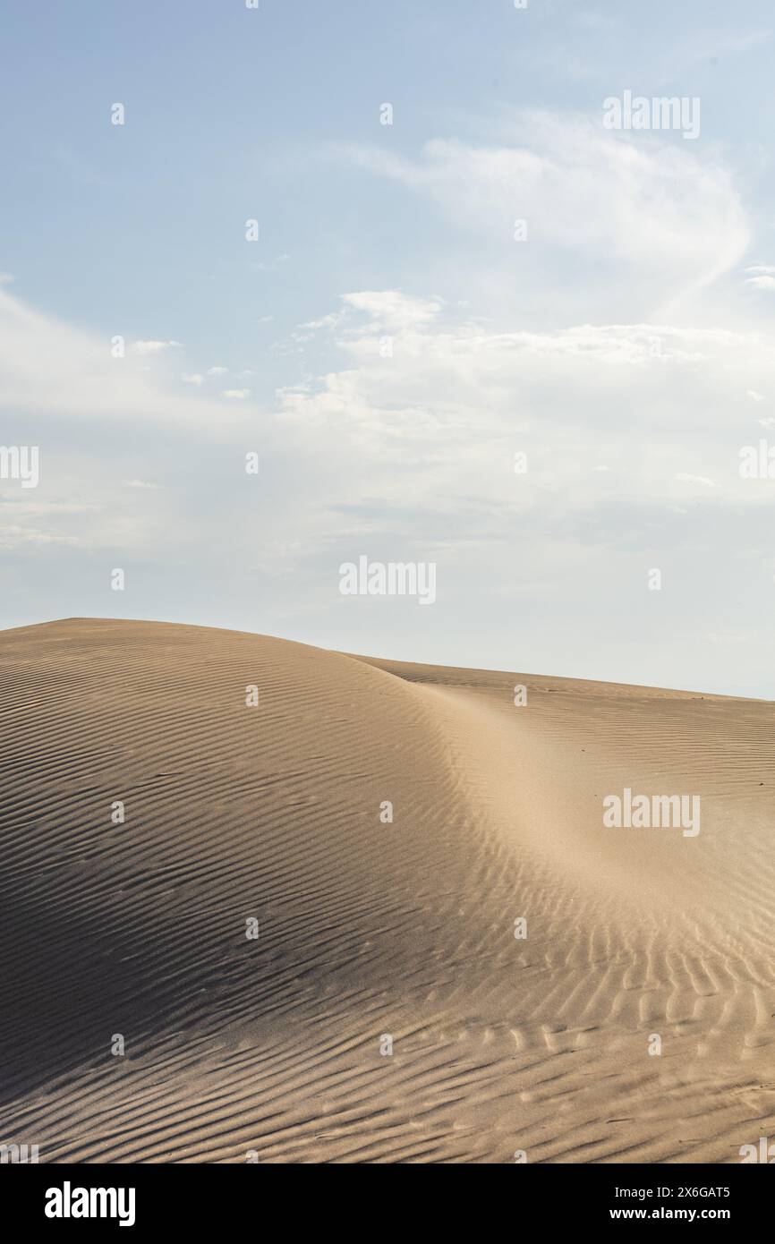 Texture of dunes in desert Sand shaped like wave on earth blue sky with ...