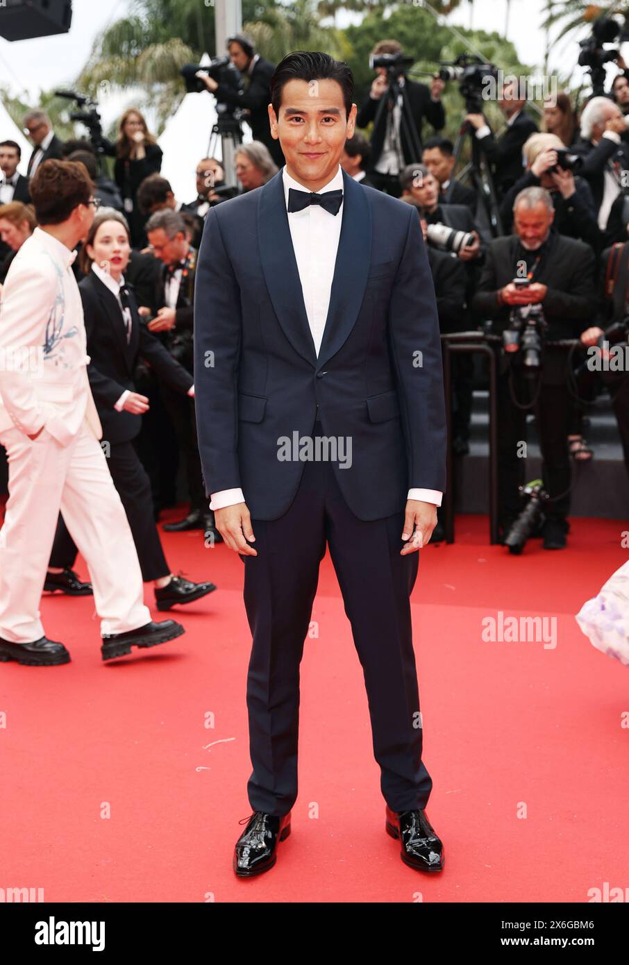 CANNES, May 15, 2024 (Xinhua) -- Actor Eddie Peng arrives at the red ...