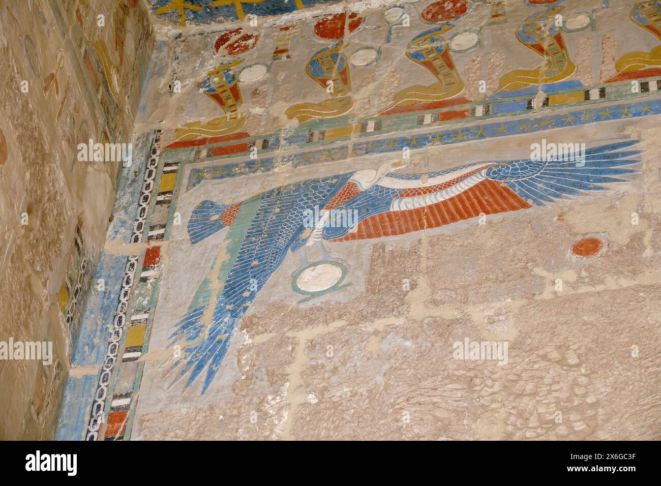 Painted reliefs showing vulture and cobra at the Temple of Hatshepsut ...