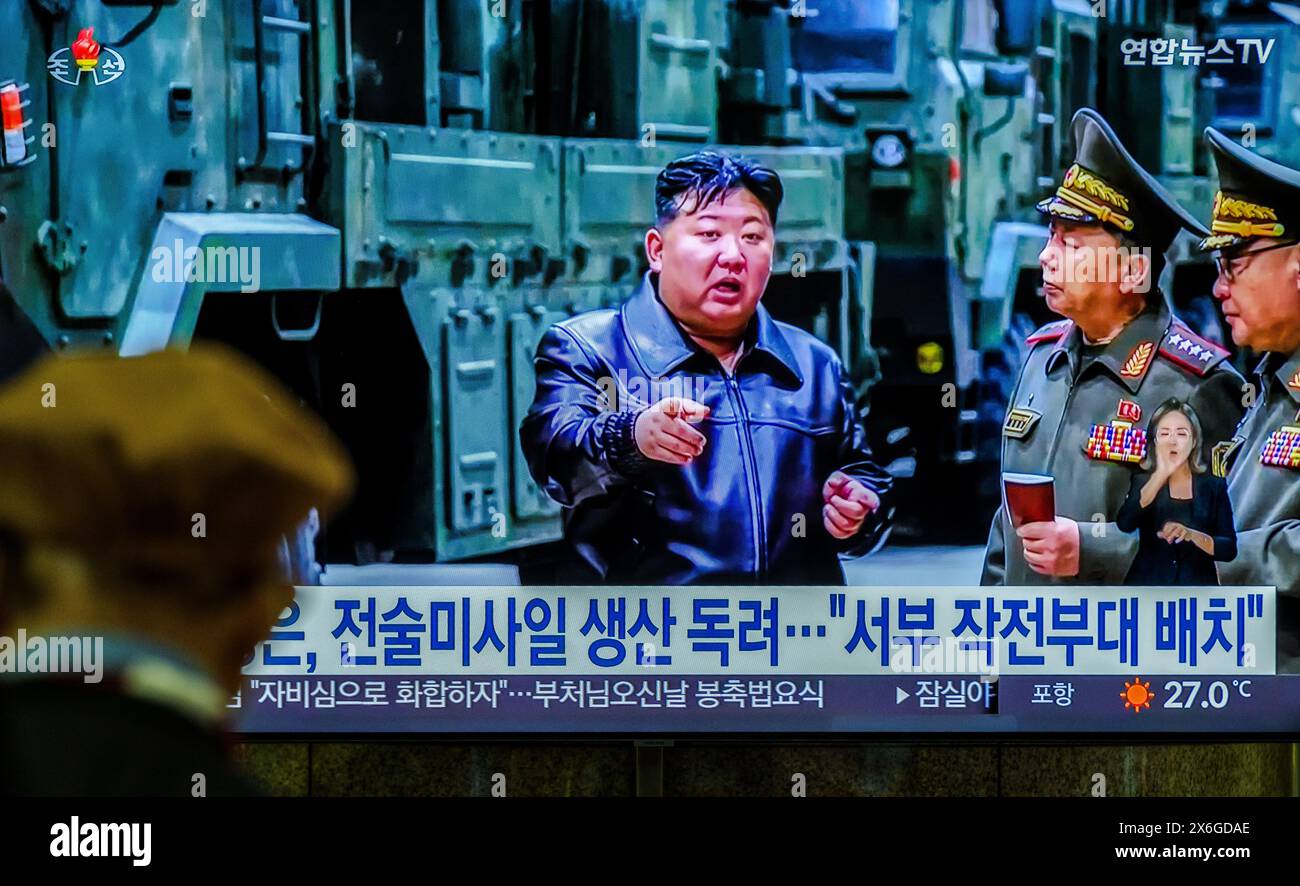 A 24-hour Yonhapnews TV broadcast at Yongsan Railway Station in Seoul ...