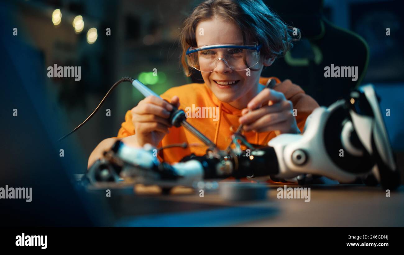 Smart Young Teenage Schoolboy is Studying Electronics and Soldering ...