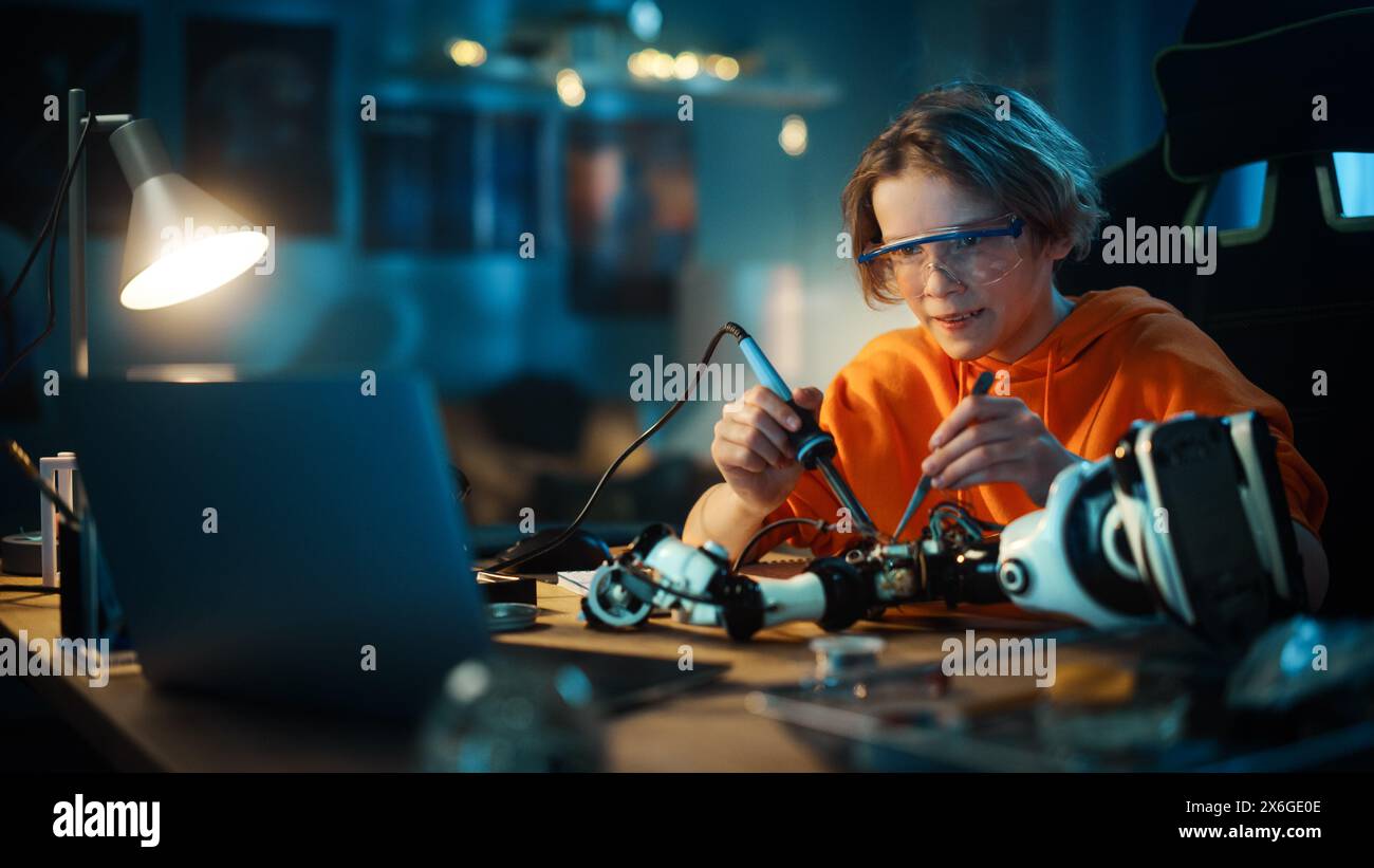 Smart Young Teenage Schoolboy is Studying Electronics and Soldering ...