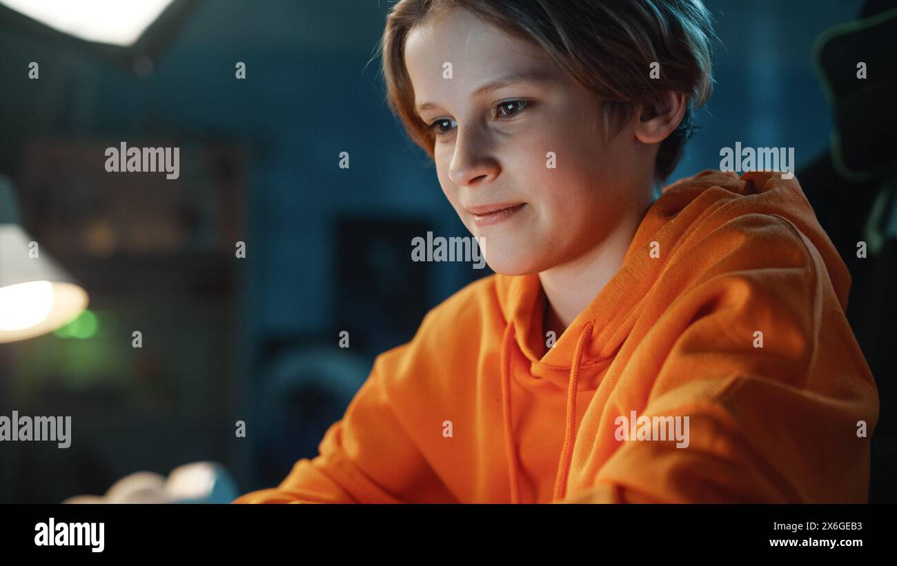 Portrait of a Cute Young Teenage Boy Being Concentrated on a Computer ...
