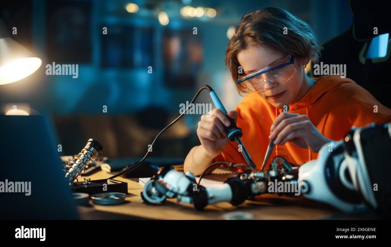 Smart Young Teenage Schoolboy is Studying Electronics and Soldering ...