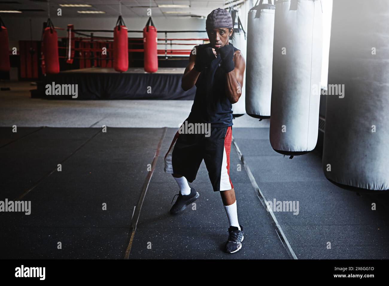 Fitness, punching and portrait of black man in boxing gym for MMA ...