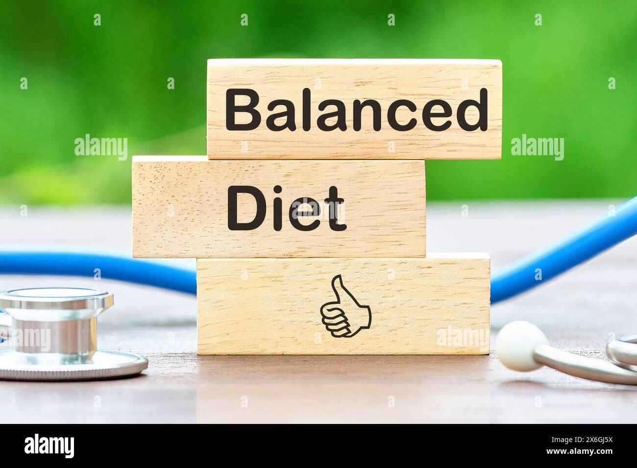 Balanced food. Balanced Diet text written on wooden bars next to the ...