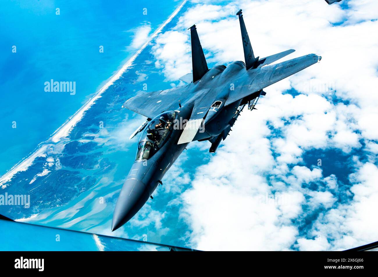 An F-15E Strike Eagle with the 4th Fighter Wing flies towards the wing ...