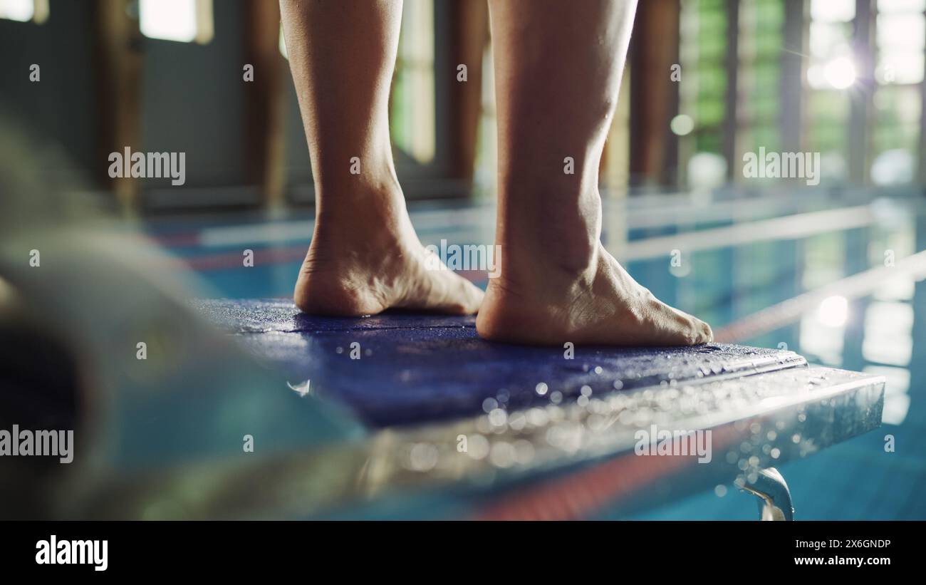 Olympic Swimming Pool: Professional Swimmer Standing on a Starting ...